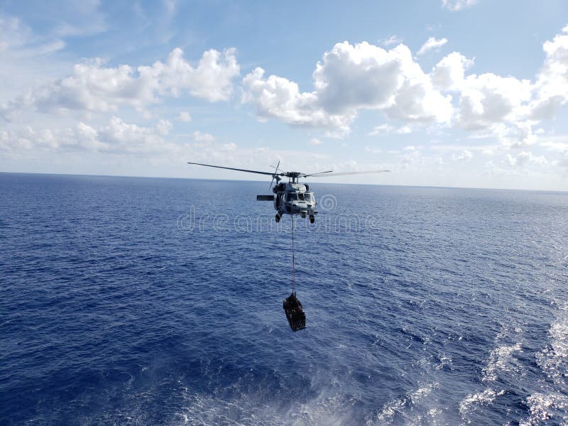 Helicopter Flying Over the Ocean. Editorial Photo - Image of ...