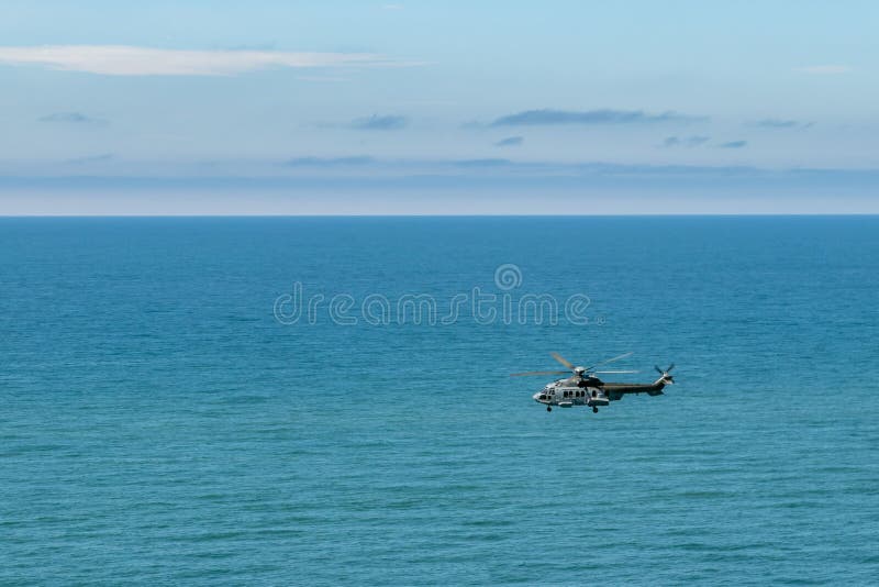 Helicopter Flying Over the Sea Stock Photo - Image of fast, flight ...