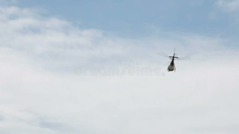 Helicopter Flying in Blue Sky with White Clouds Away from Camera Stock Footage - Video of cloud ...