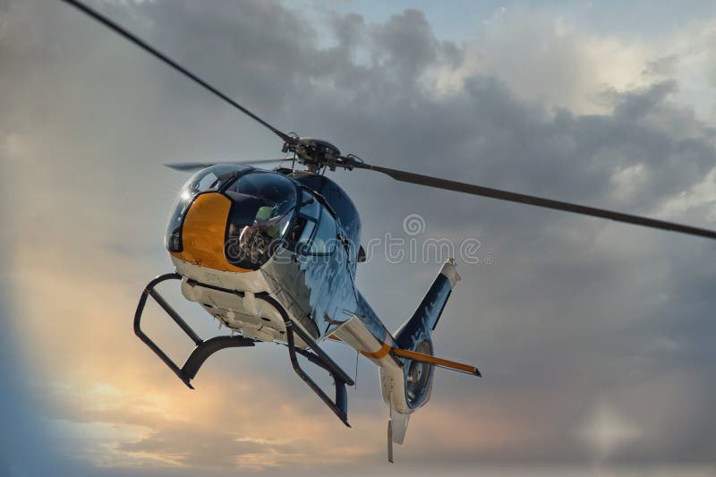 Helicopter flying in sky stock photo. Image of isolation - 262361080