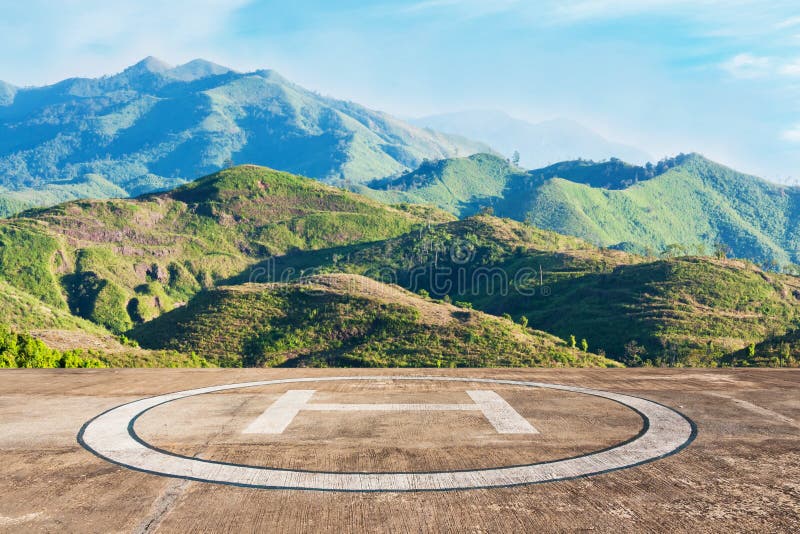 Helipad in the Park with Mountains Stock Photo - Image of cloudy ...