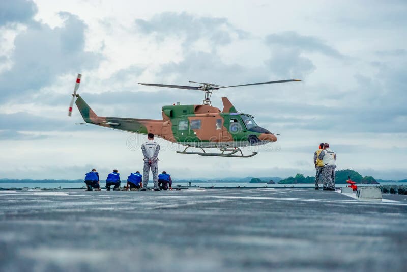 Helicopter landing editorial photo. Image of blue, navy - 72534301