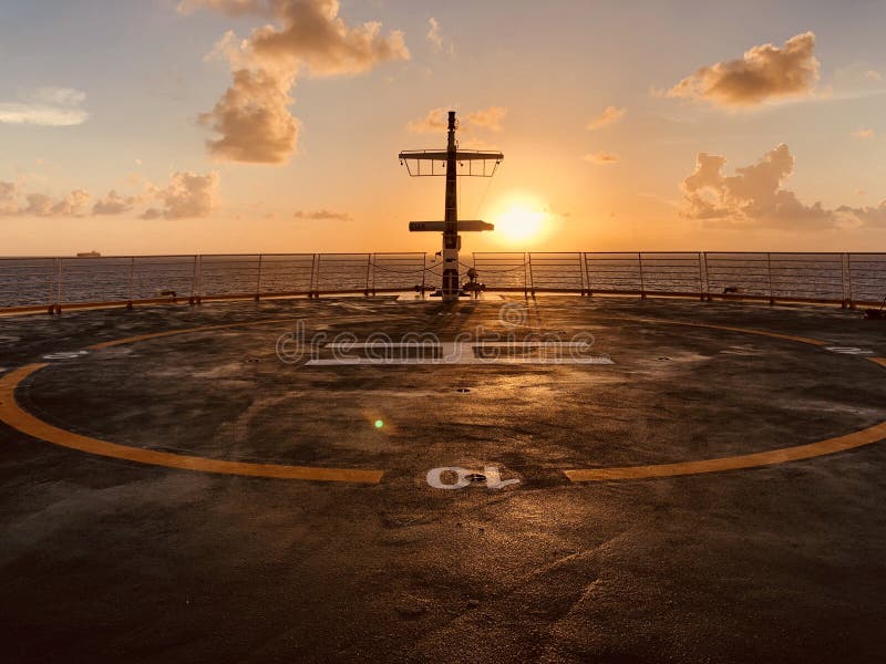Helicopter Landing Pad on the Front of a Ship at Sunset Stock Photo ...