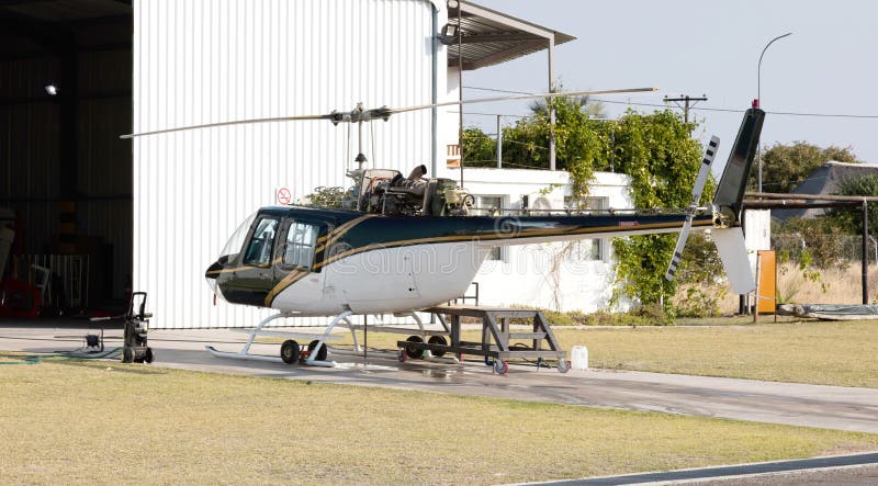 Helicopter Maintenance Femail Worker. Woman Pilot or Helicopter ...