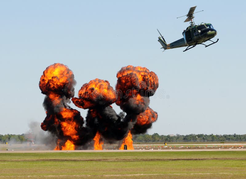 Helicopter over explosion stock image. Image of flying - 12816131