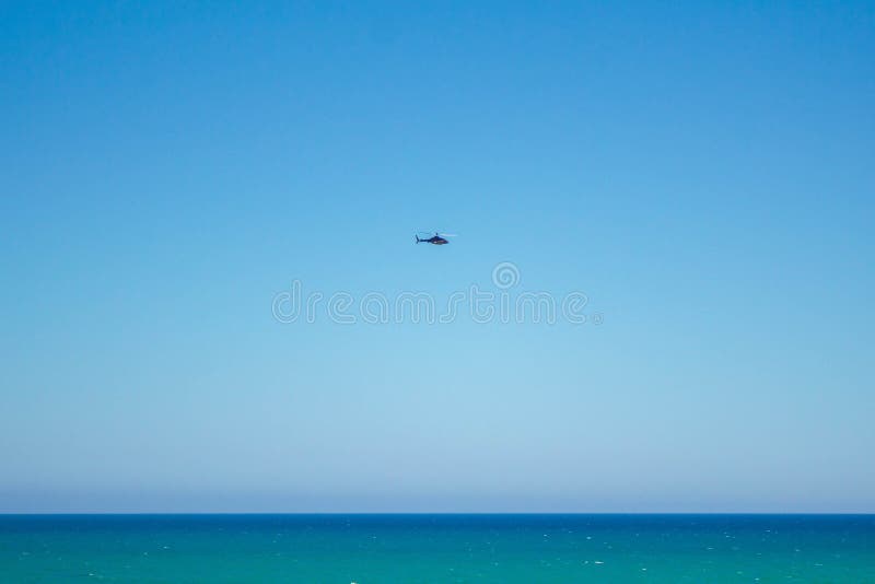 Helicopter over the sea stock image. Image of vehicle - 79492095