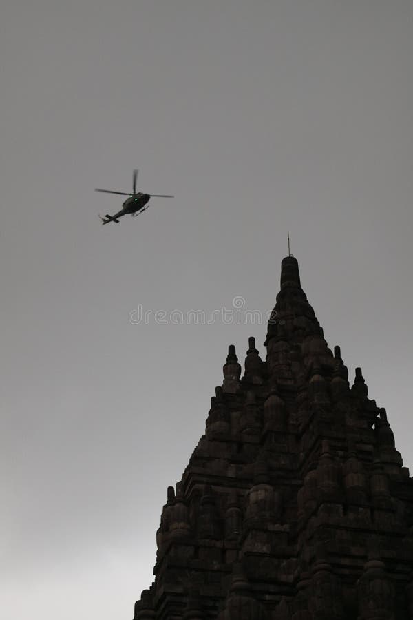 Helicopter Passing Above Prambanan Temple Stock Photo - Image of iron ...
