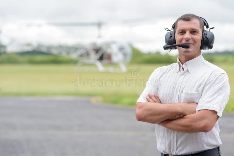 Helicopter pilot outdoors stock image. Image of person - 285208755