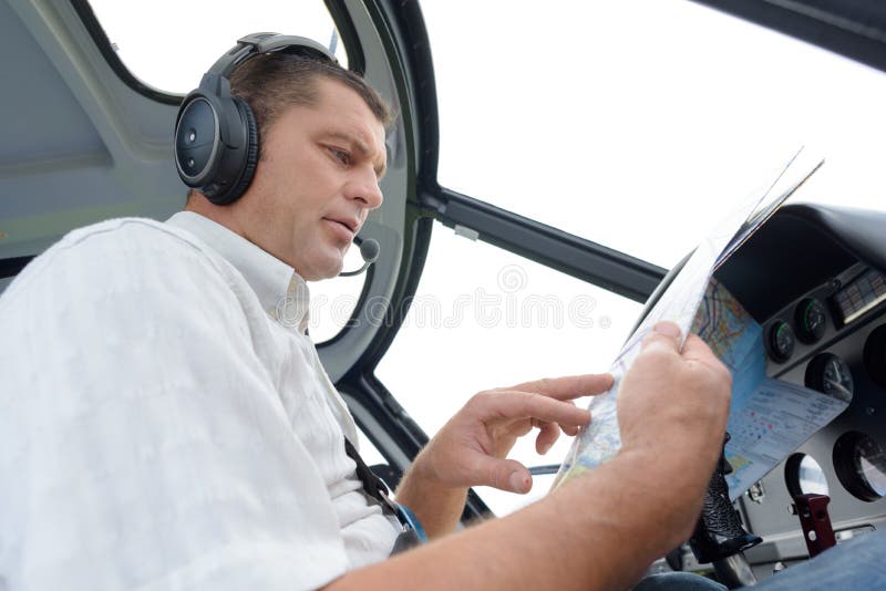 Helicopter pilot reading stock photo. Image of captain - 250316050
