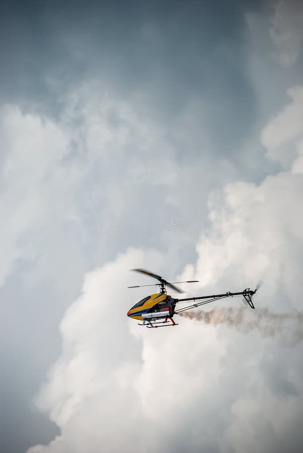 Helicopter Pirouettes Amid Rain Clouds. Stock Photo - Image of clouds ...