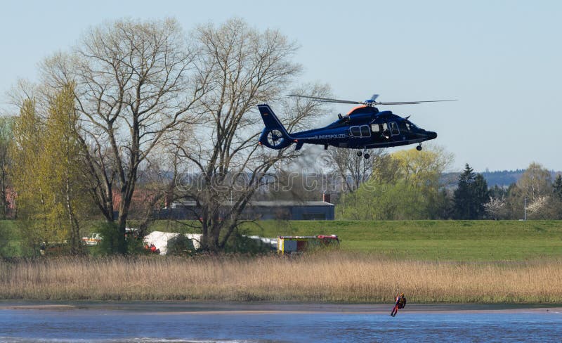 A Helicopter rescue a man editorial photo. Image of helicopters - 53949721