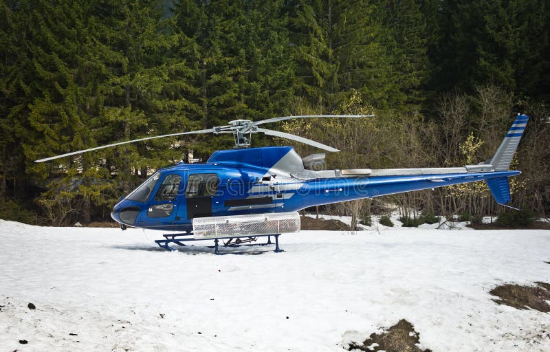 Helicopter Resting on the Snow Stock Image - Image of blue, resting ...