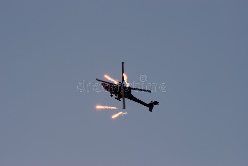 Helicopter shooting flares stock photo. Image of armed - 44903914