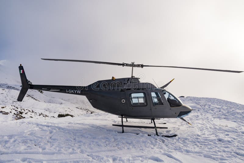 Red helicopter in snow stock photo. Image of rotor, quebec - 4749520