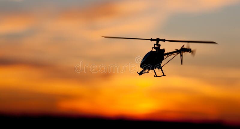 Helicopter at sunset stock image. Image of landscape - 26654853
