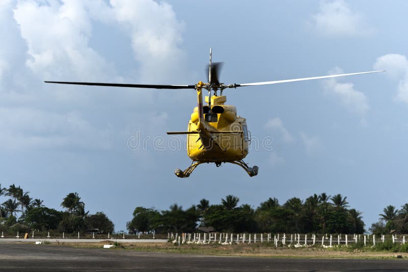 Helicopter Taking Off stock image. Image of yellow, aviation - 90475189