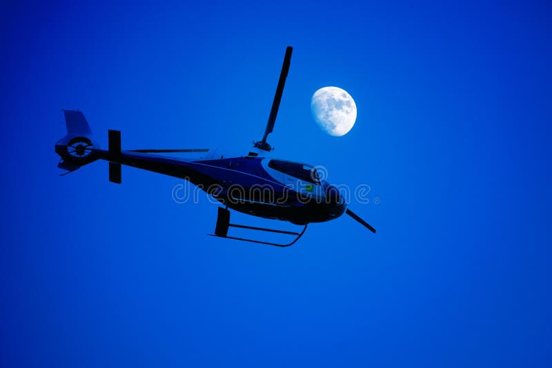 Helicopter flying at night stock image. Image of warmth - 35579711