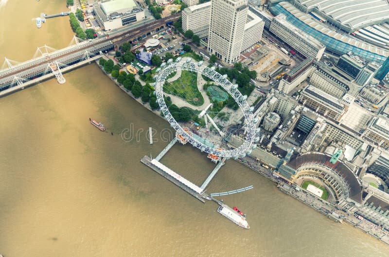 Helicopter View of London Eye and Buildings Along Thames River ...