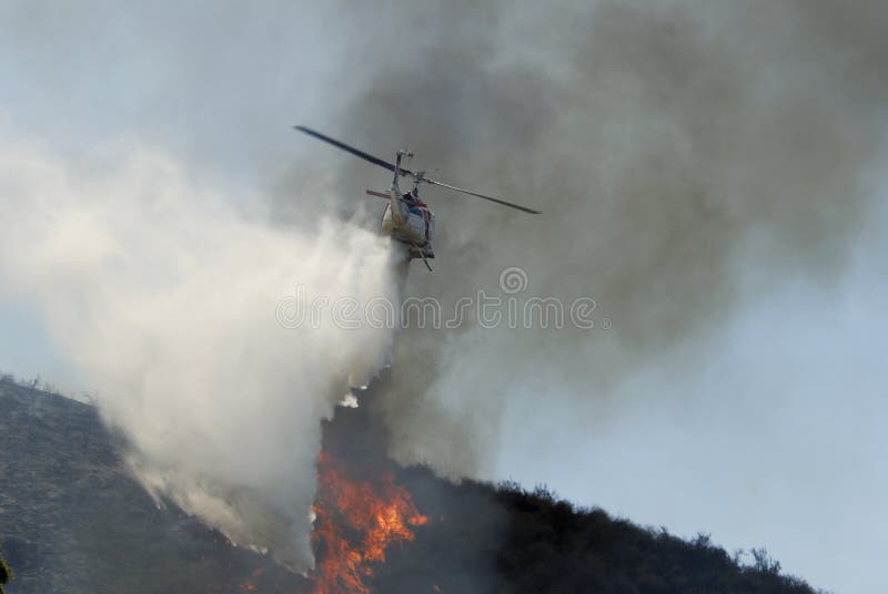 Helicopter water drop stock image. Image of wild, brush - 5837833