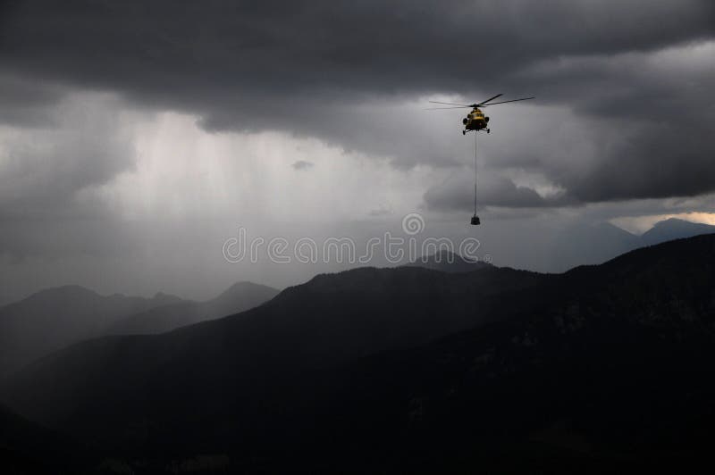 Helicopters in the rain stock image. Image of rain, landscape - 21939551