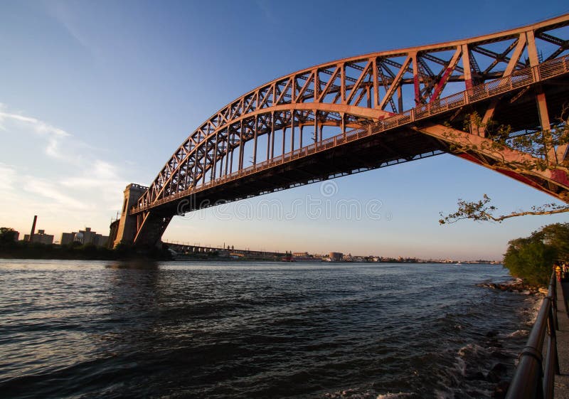 The Hell Gate Bridge Over the River with Sunset Stock Image - Image of ...