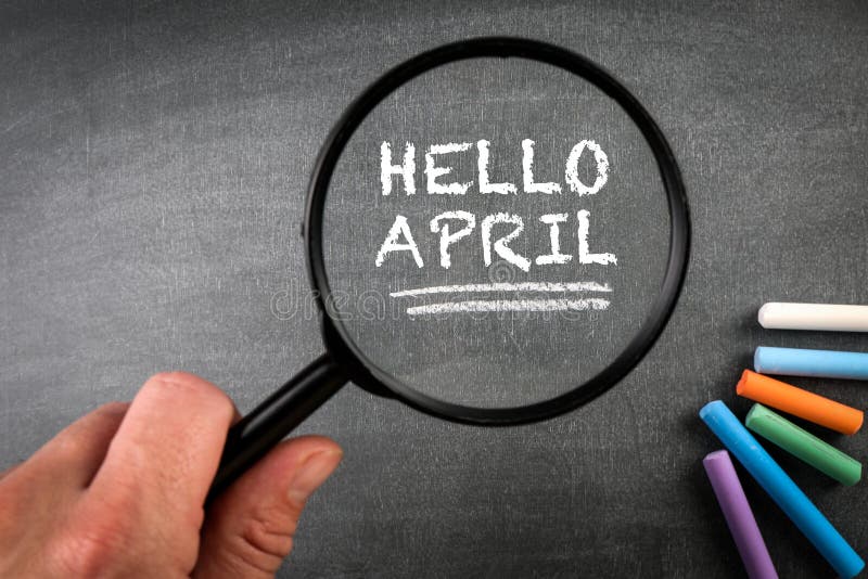 Hello April. Colored Pieces of Chalk and a Magnifying Glass on a ...