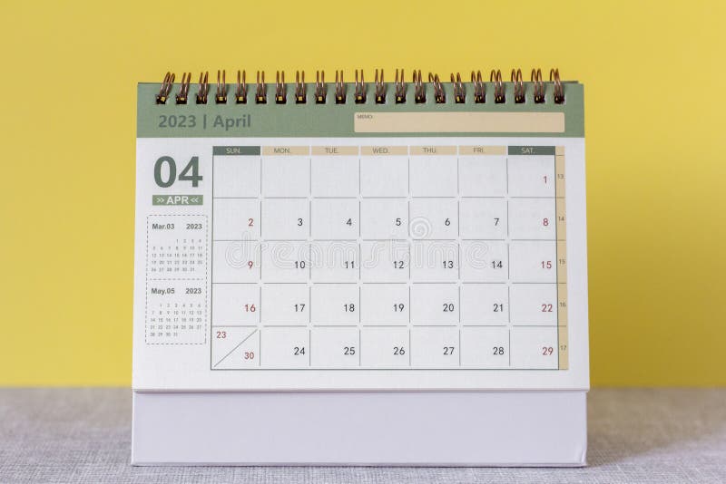 Hello April.Desktop Calendar for April 2023 on the Table Stock Image ...