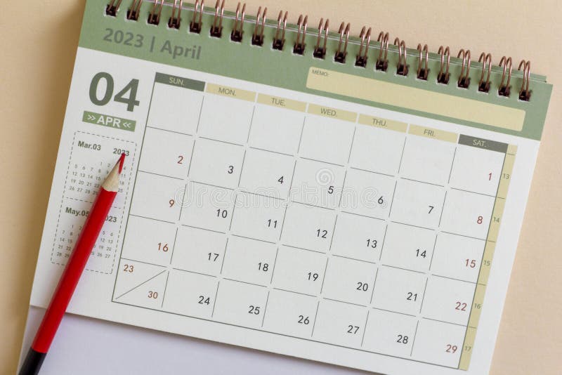 Hello April.Desktop Calendar for April 2023 on the Table. Stock Photo ...