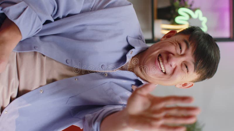 Asian Man Smiling Friendly at Camera, Waving Hands Gesturing Hello, Hi ...