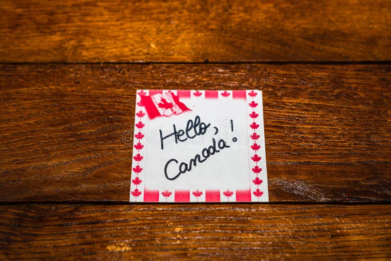 Hello Canada Handwriting on Paper with Canada Flag. Writing Text on ...