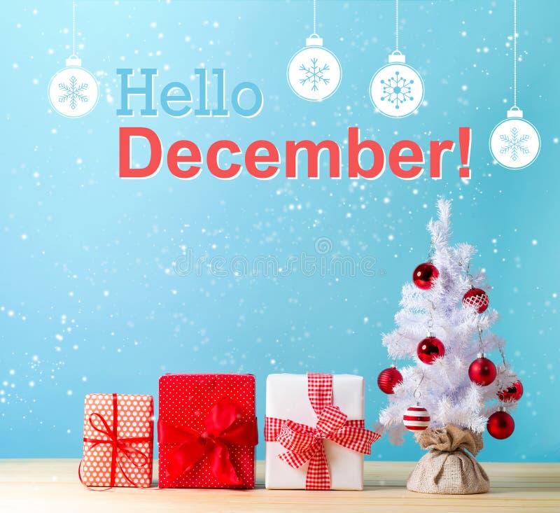 Hello December Message with a Christmas Tree and Gift Boxes Stock Photo ...