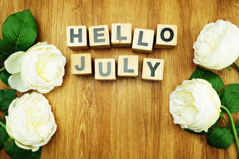 Hello July Typography Text Decorate with Flower on Wooden Background ...