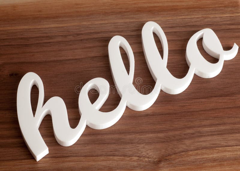 Hello on Mahogany Table stock image. Image of plastic - 24635695