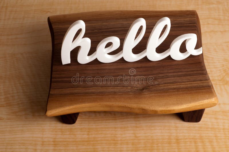 Hello on Mahogany Table stock image. Image of close, word - 24635703