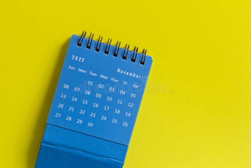 Hello, November.Desktop Calendar for November 2022 on a Yellow ...
