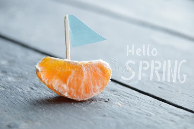 Hello Spring Concept. Orange Slice and Sail. Stock Photo - Image of ...