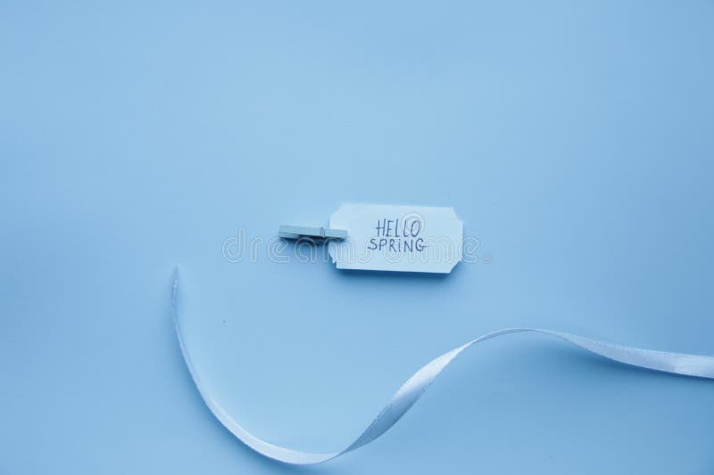 Hello Spring. the Inscription on a Blue Label on a Blue Background. Stock Image - Image of decor ...