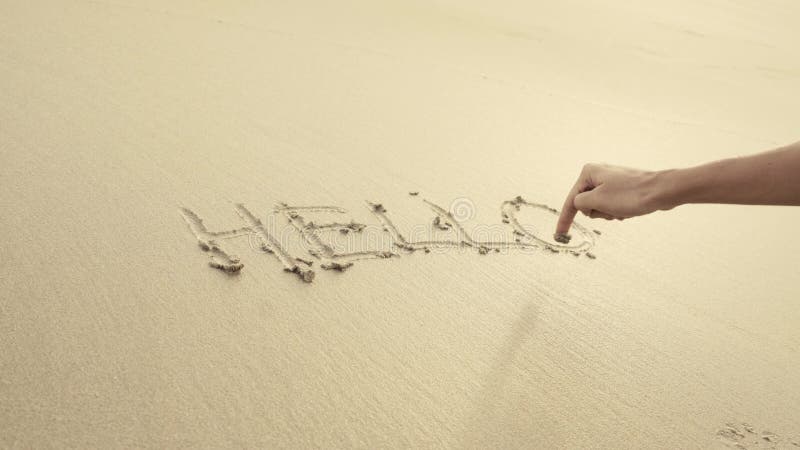 HELLO SUMMER Written on the Beach Sand Washed Aways by Waves. Stock ...