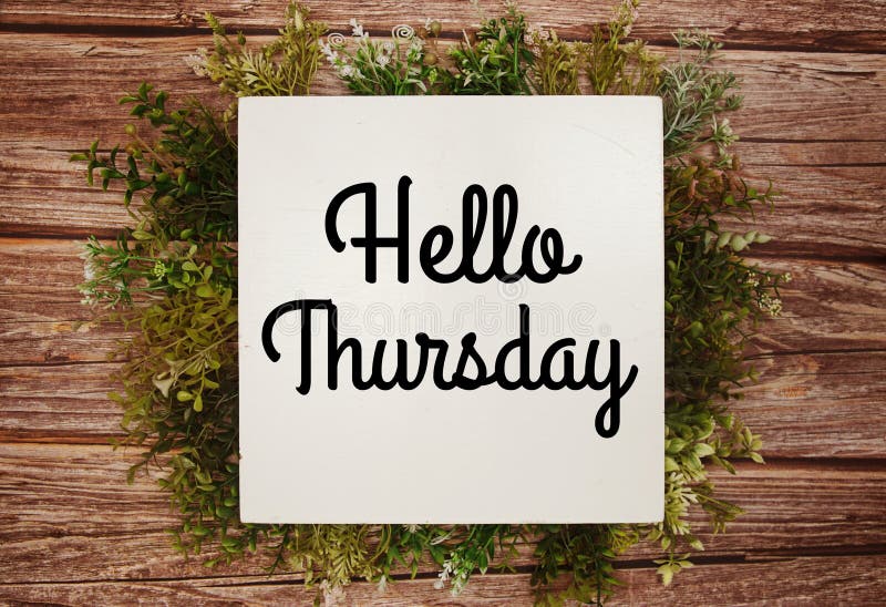 Hello Thursday Text Message with Green Leaves Decoration on Wooden ...