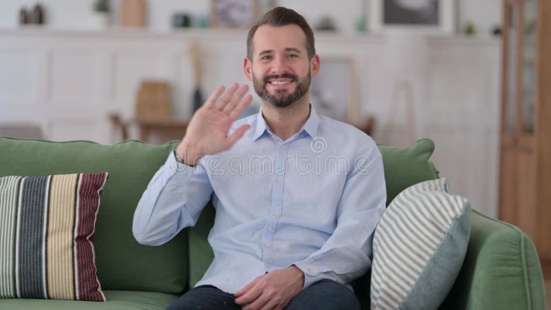 Hello by Welcoming Young Man Waving at Camera Stock Photo - Image of ...