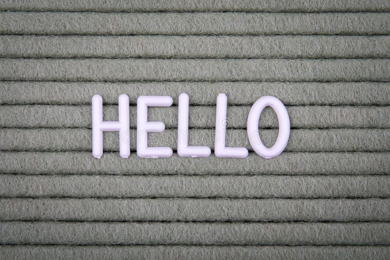 HELLO. White Letters of the Alphabet on a Green Background Stock Photo ...