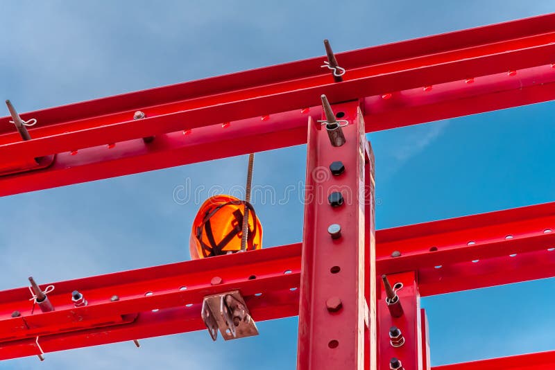 Helmet builder on a beam stock photo. Image of activity - 252974910