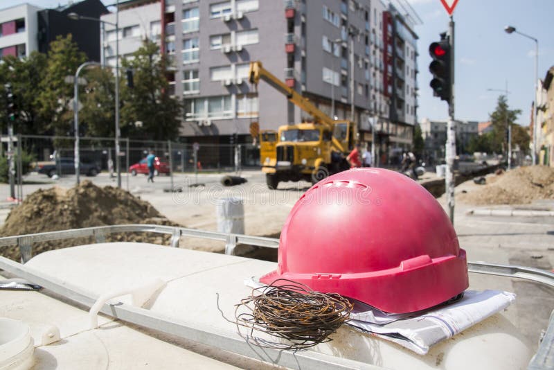 The Helmet on the Construction Plans and Buildings in the Background ...