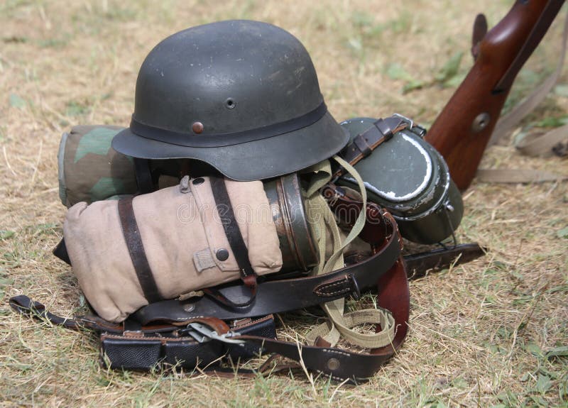 Helmet with a Rifle in the Army Camp during a War Exercise Stock Photo ...
