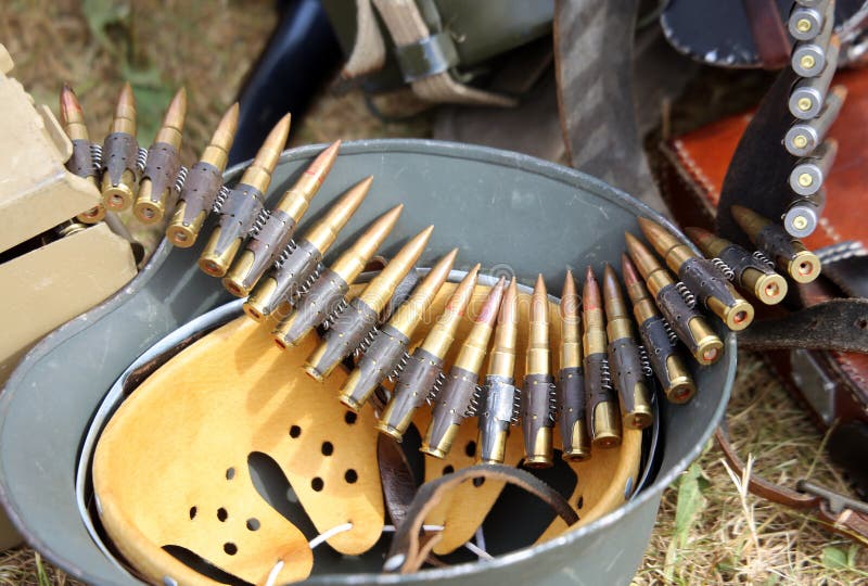 Helmet of Soldier Uniform with Bullets in the Army Camp during a Stock ...