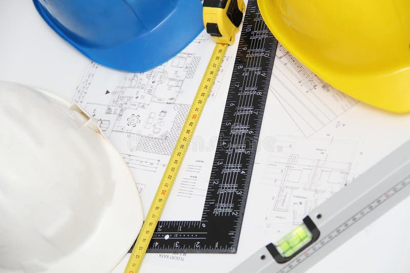 Helmets and Tools for Construction Drawings and Buildings Stock Photo ...
