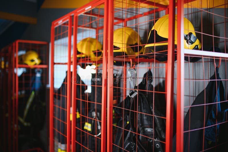 Helmets and Uniforms in Locker Room of Fire Fighters Stock Image ...