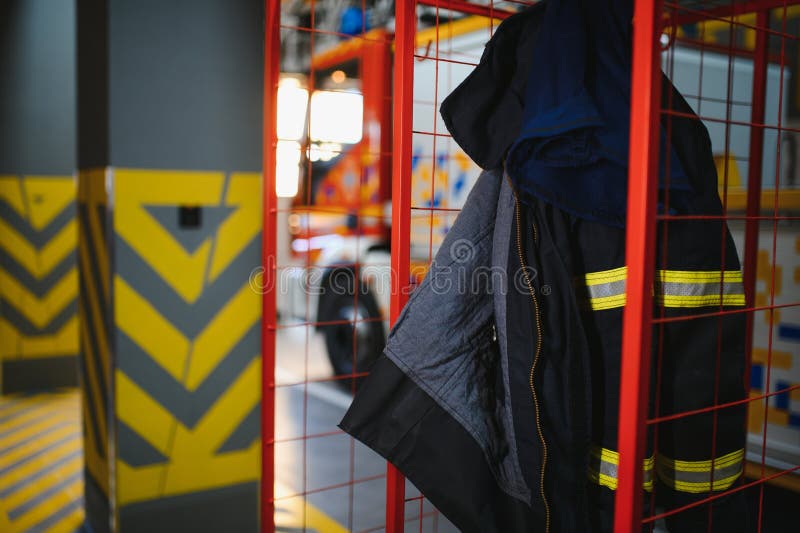 Helmets and Uniforms in Locker Room of Fire Fighters Stock Photo ...