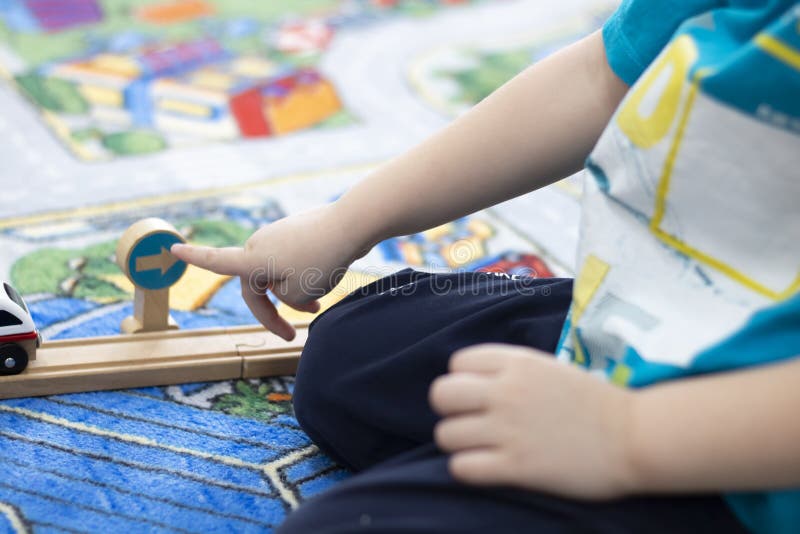 With the Help of the Game, the Child Studies Road Signs, Points with ...