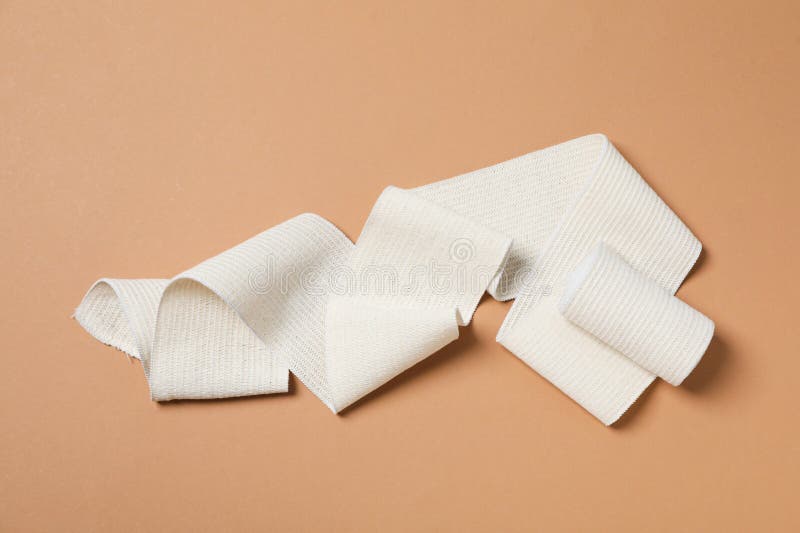 Help during an Injury, Elastic Bandage on Beige Background Stock Photo ...